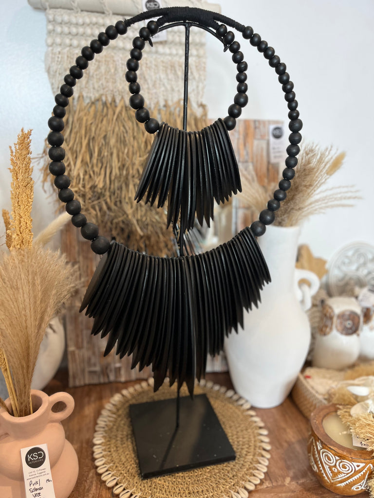 Black timber decoration on stand – Bali Beach Beyond